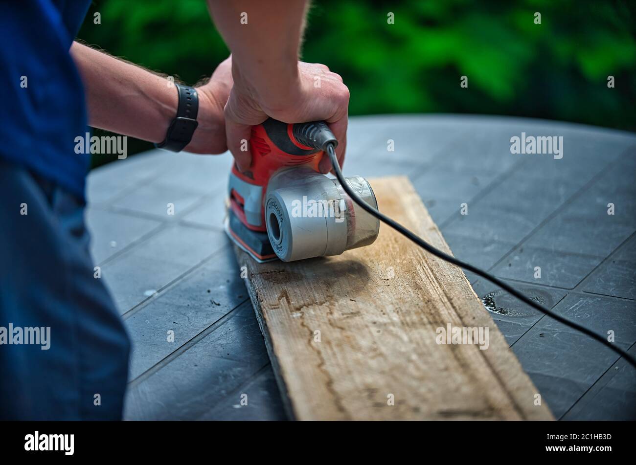 Hand wooden board is processed with a grinding machine Stock Photo - Alamy