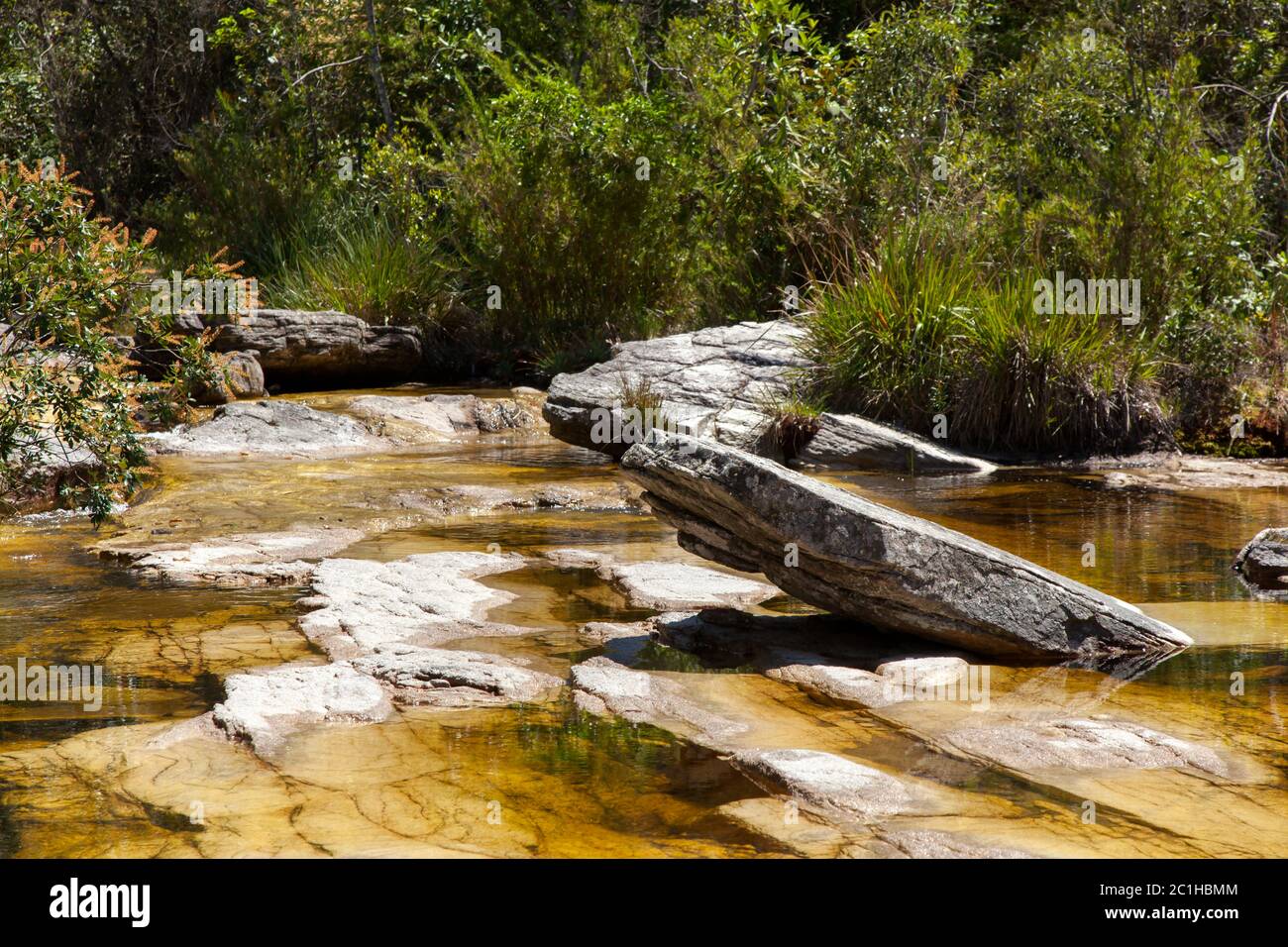 Yellow water river on quartzite rocks Stock Photo - Alamy