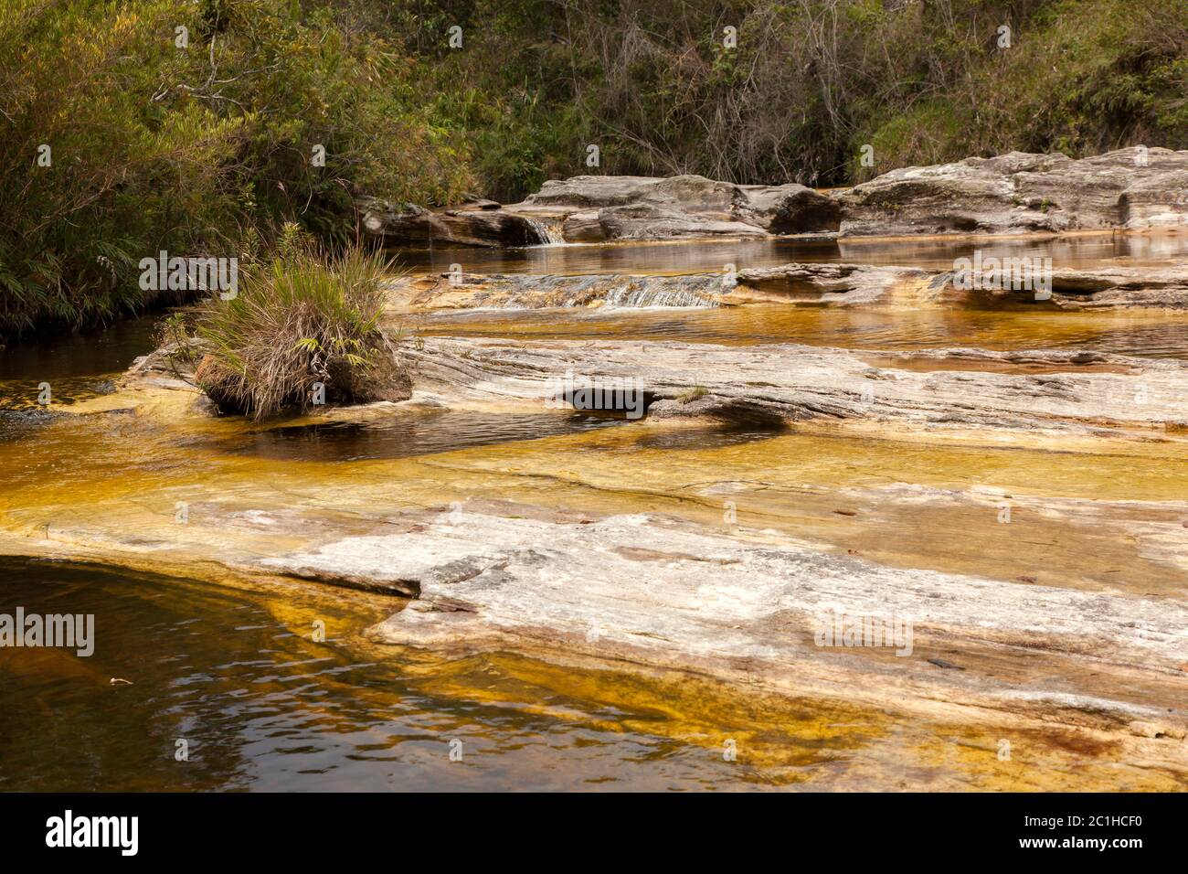 Yellow water river on quartzite rocks Stock Photo - Alamy