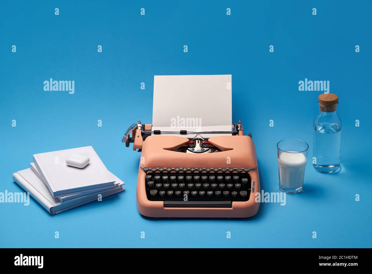 Composition with typewriter, books, glass and bottle Stock Photo - Alamy