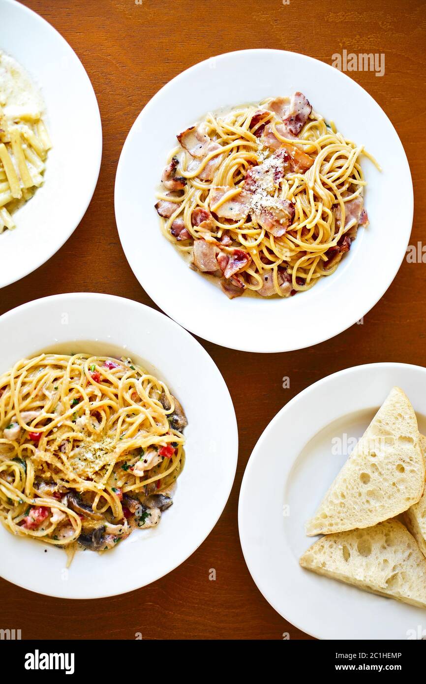 Various kind of Italian pasta spaghetti with tomato, proshutto, seafood ...