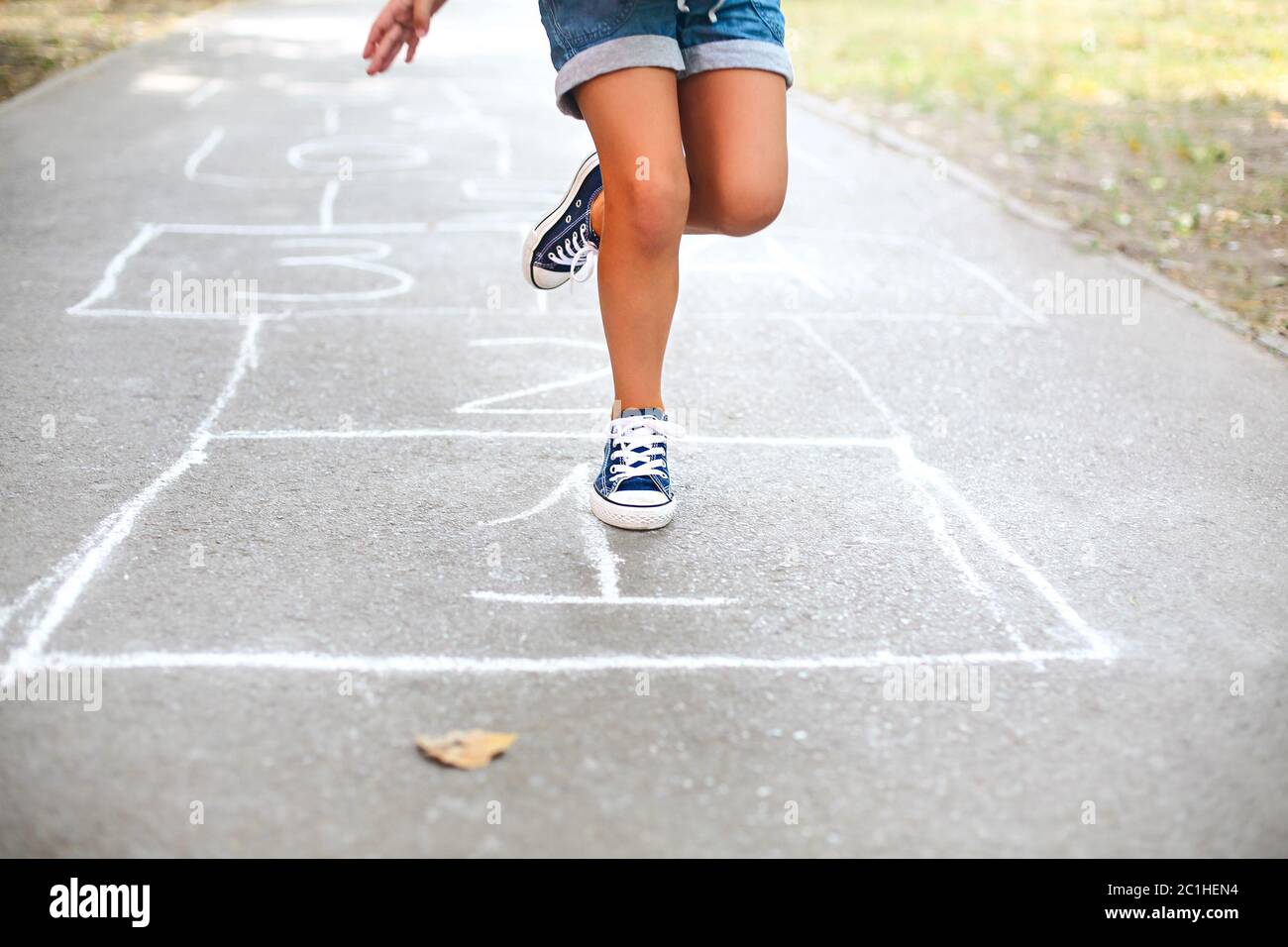 Kids playing hopscotch hi-res stock photography and images - Alamy
