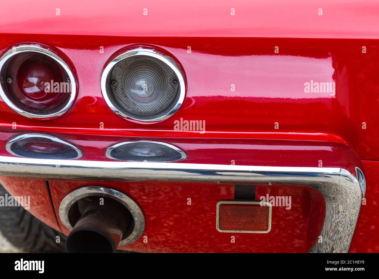 Rear view of an American sports car of the sixties Stock Photo - Alamy