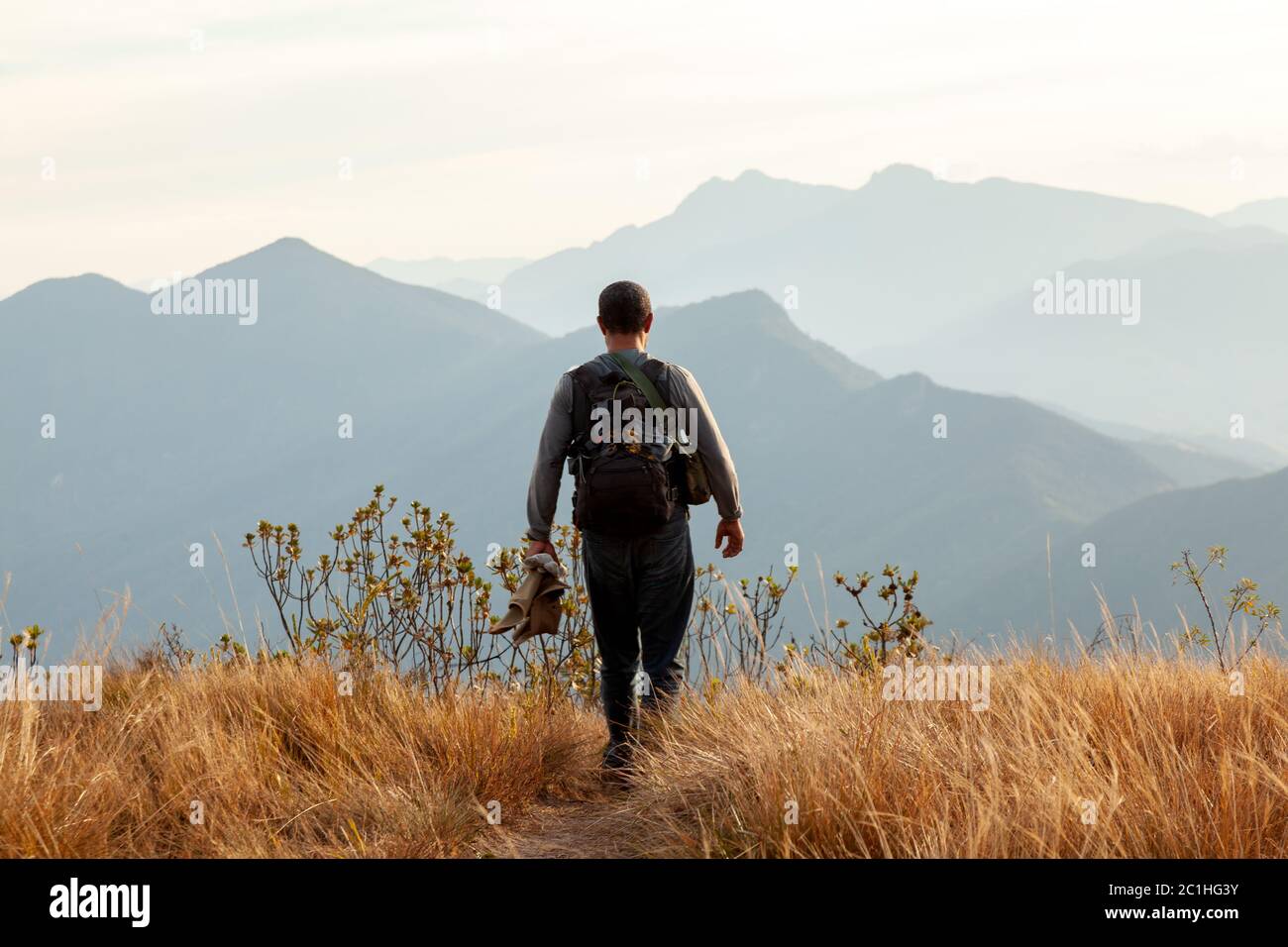 People walking in mountain landscape - trekking hiking mountaneering ...