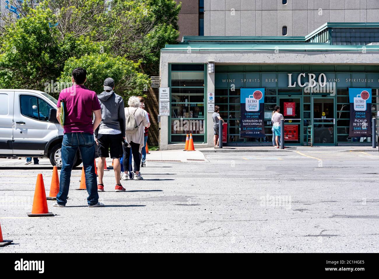 Toronto, Canada. 14th June 2020. Shoppers line up outside an LCBO ...
