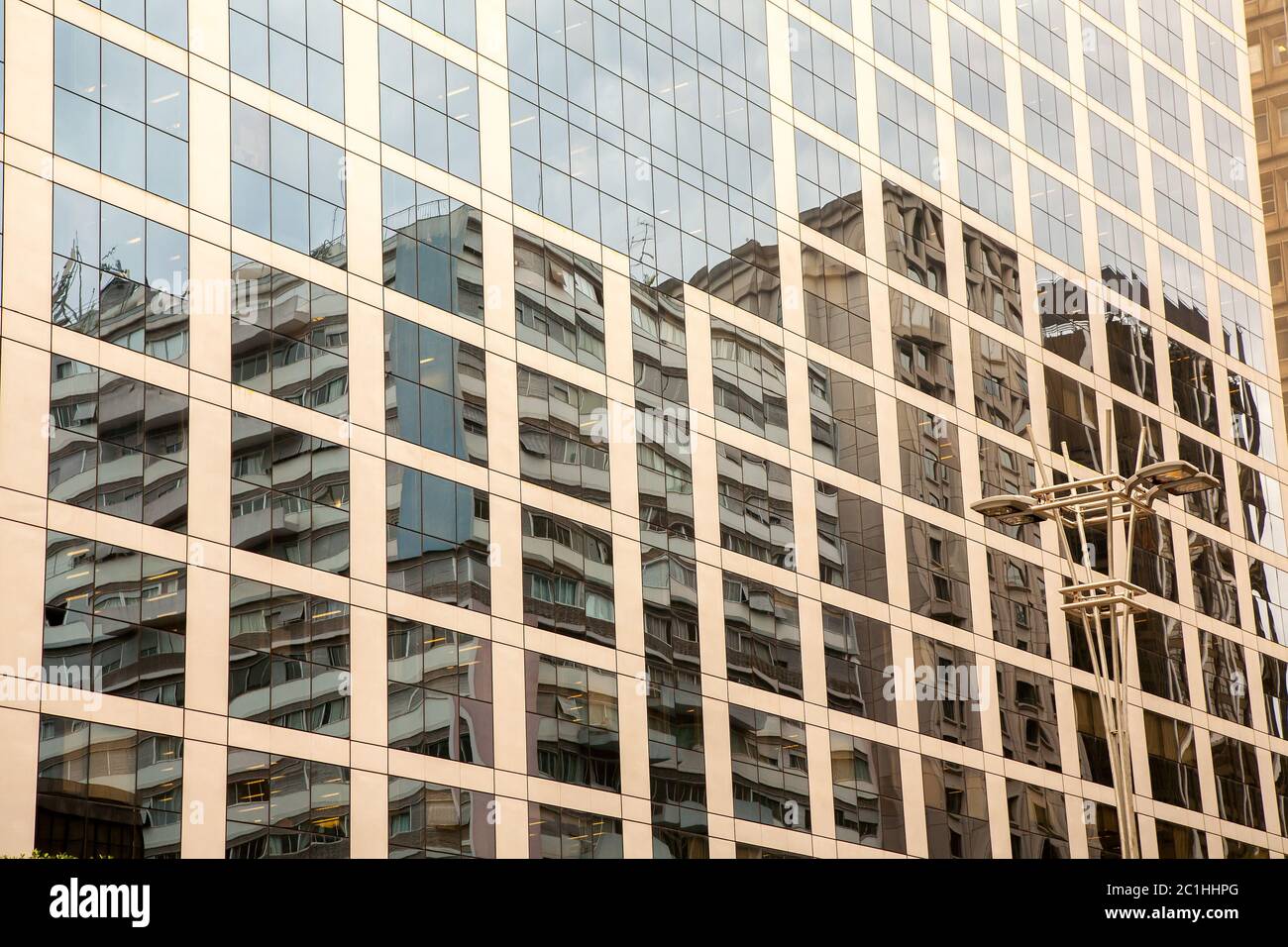 Glass and concrete facade on a modern corporate skycraper building ...