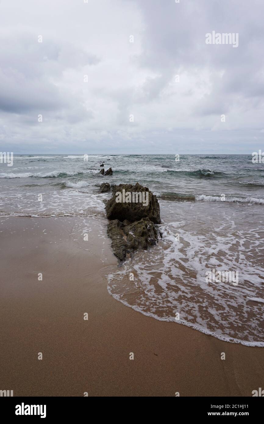 sand and rocks in the beach Stock Photo - Alamy