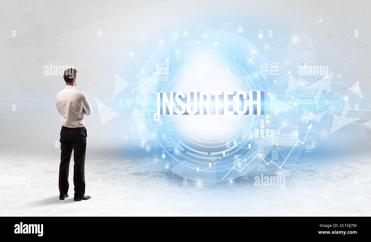 Rear view of a businessman standing in front of INSURTECH inscription ...