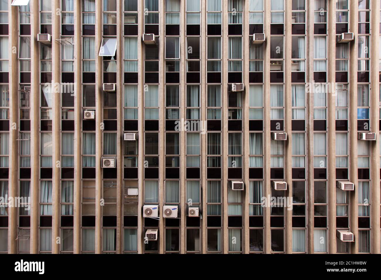 Modern glass windows in concrete building facade - urban modern ...