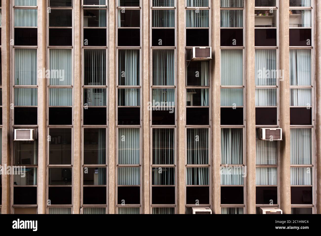 Modern glass windows in concrete building facade - urban modern ...