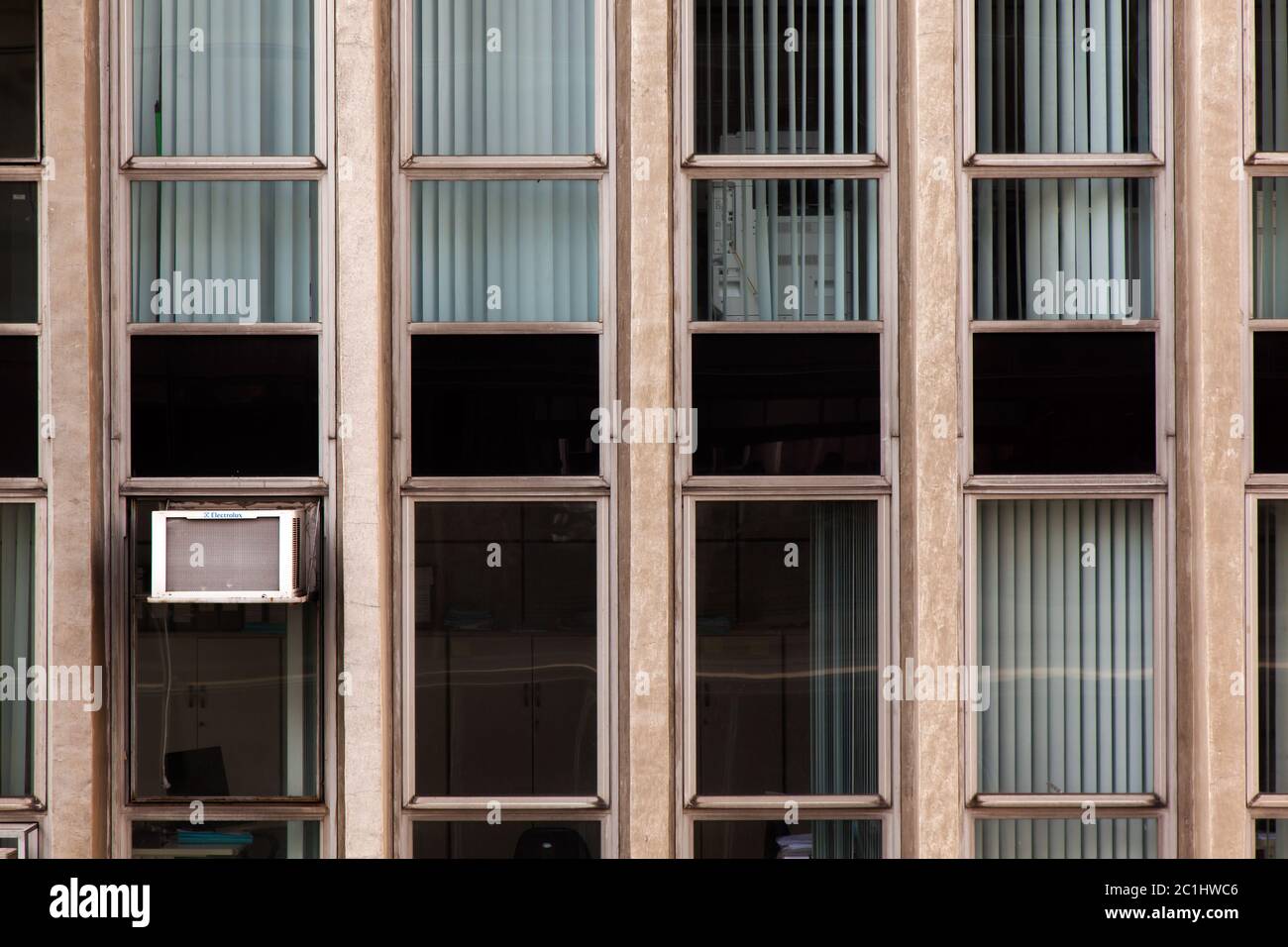Modern glass windows in concrete building facade - urban modern ...