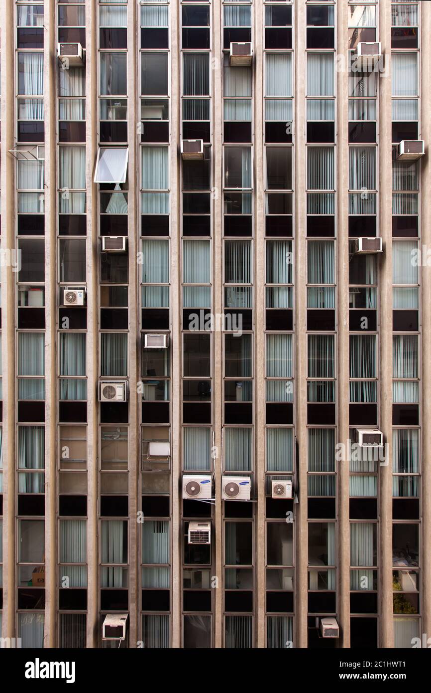 Modern glass windows in concrete building facade - urban modern ...