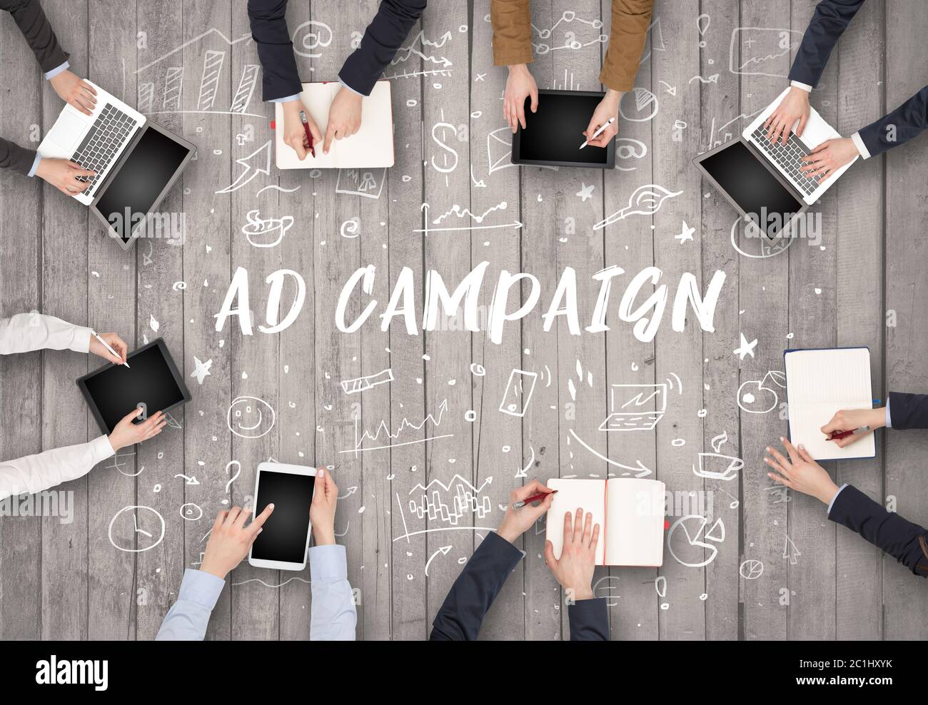 Group of business people working in office with AD CAMPAIGN inscription ...