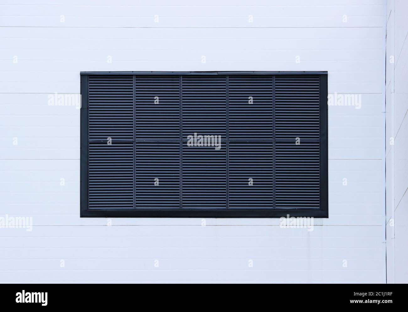 A window in a large industrial shopping center closed with external ...