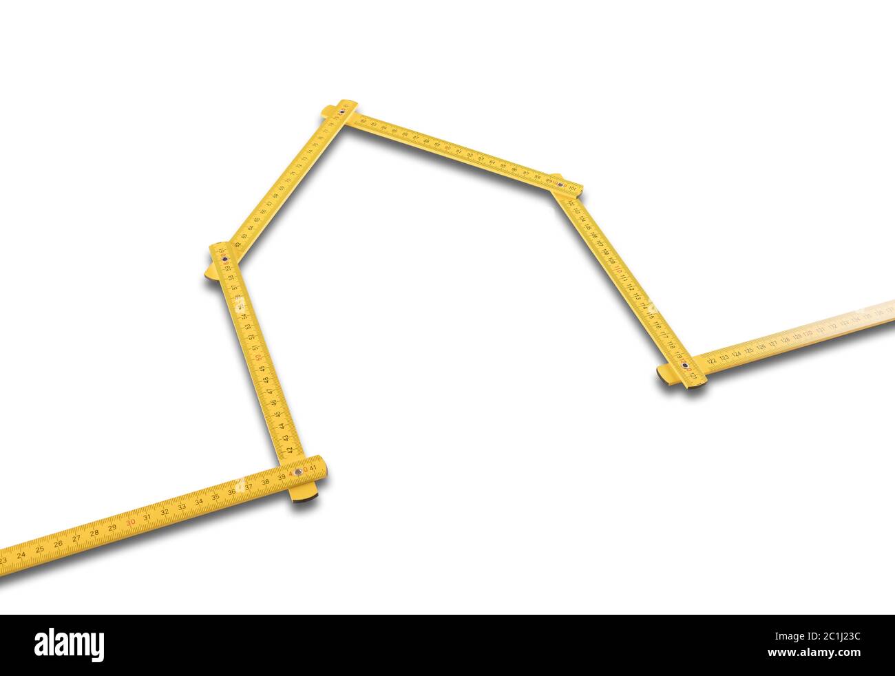 Yellow meter ruler folded as house on white background Stock Photo - Alamy
