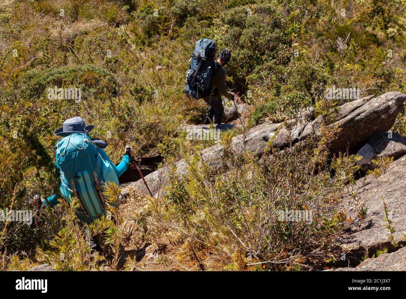 People walking with great backpacks in mountain landscape - trekking ...