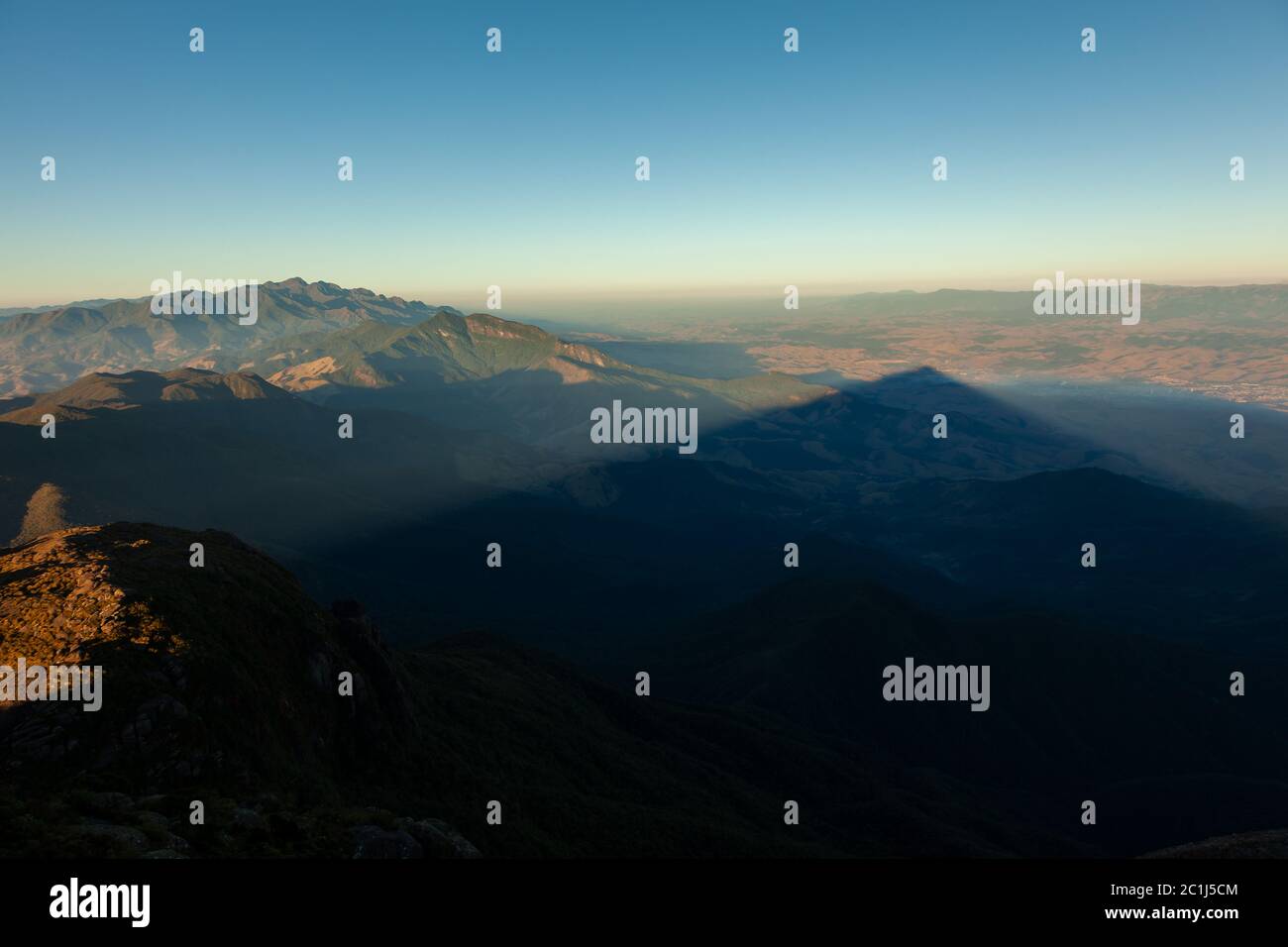 Triangular shadows of a mountain seen from the summit in mantiqueira ...