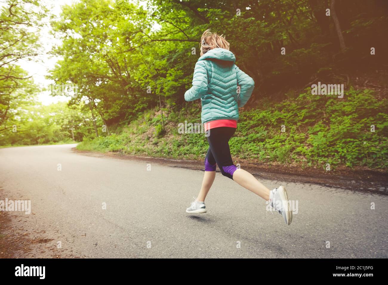 Slim blonde female rear view hi-res stock photography and images - Alamy