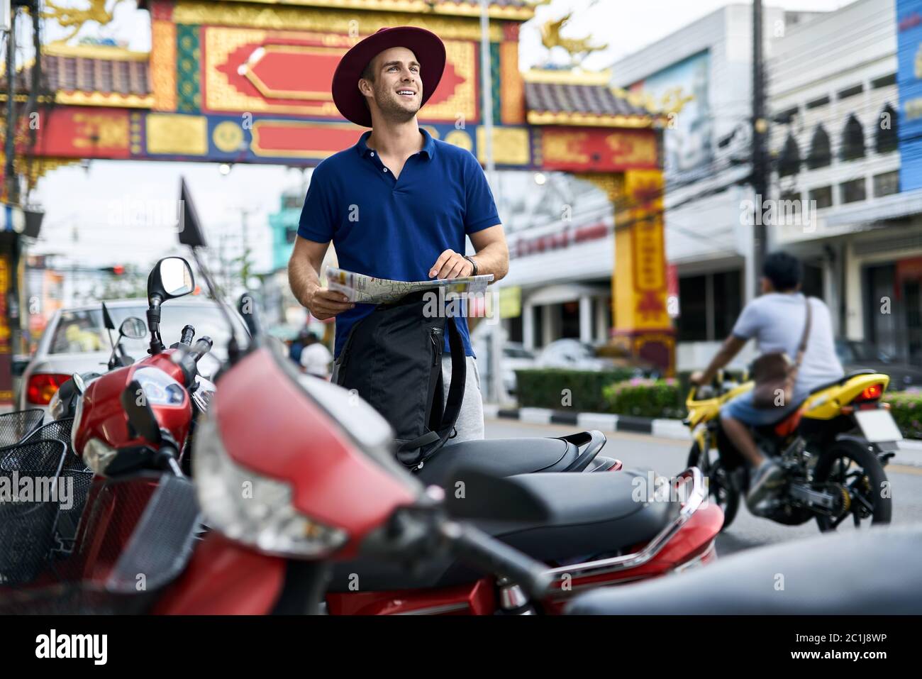 Traveler on city street Stock Photo - Alamy
