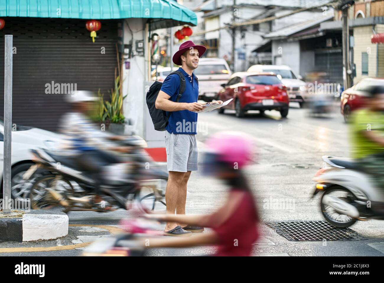 Traveler on city street Stock Photo - Alamy
