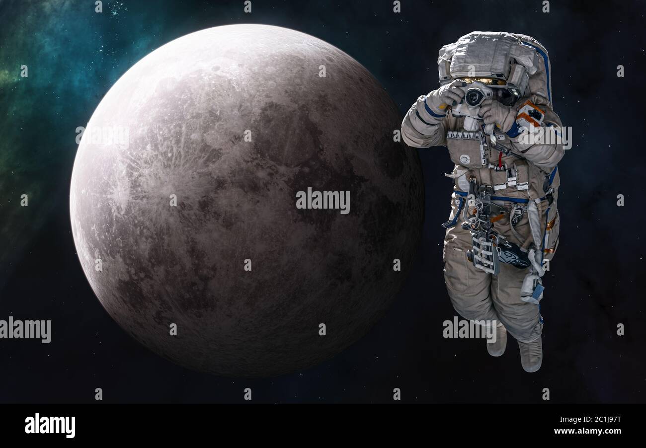Astronaut and the Moon. Solar system. Science fiction Stock Photo - Alamy