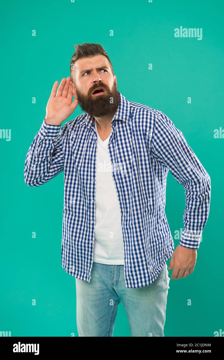 Bearded man concentrated on listening. Hearing problems. What ...