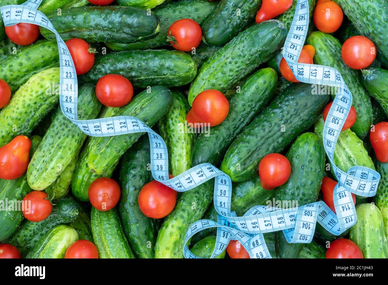 Measuring tape and fresh vegetable Stock Photo - Alamy