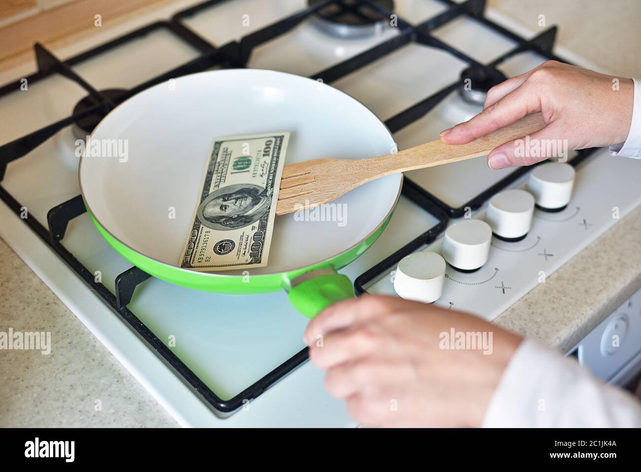 money is fried in a pan Stock Photo - Alamy