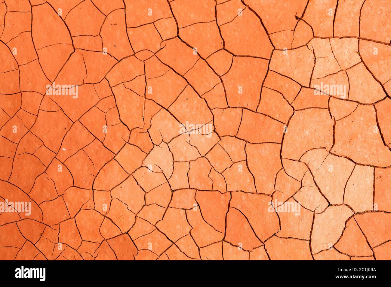 Orange drought soil pattern - no water Stock Photo - Alamy