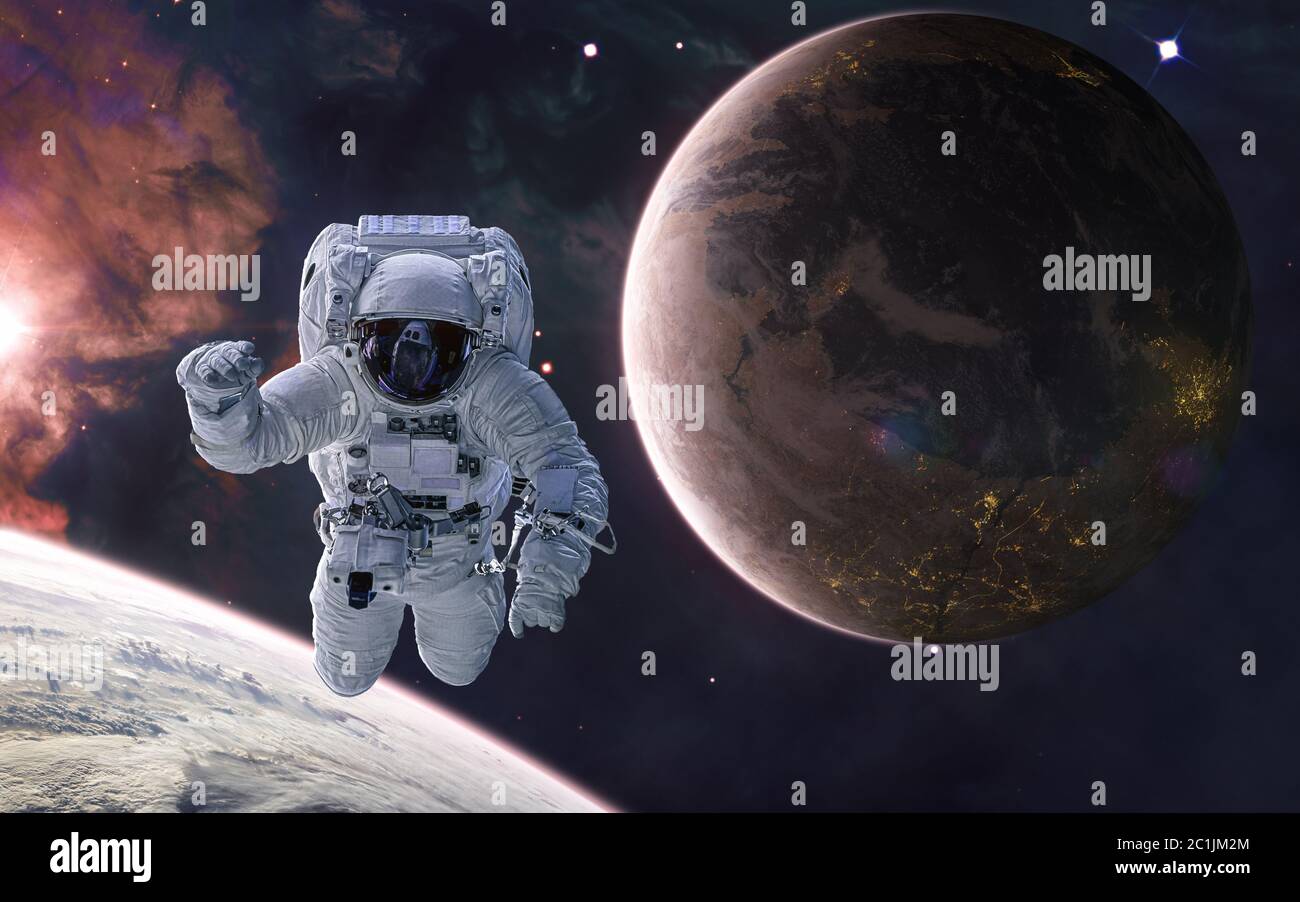 Astronaut on background of a colonized planet. Planets of deep space in ...