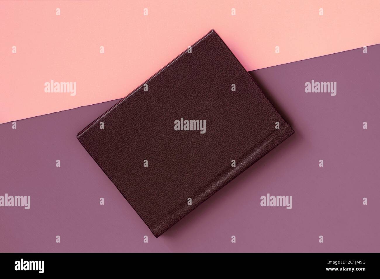 Book on a two-color background, top view Stock Photo - Alamy