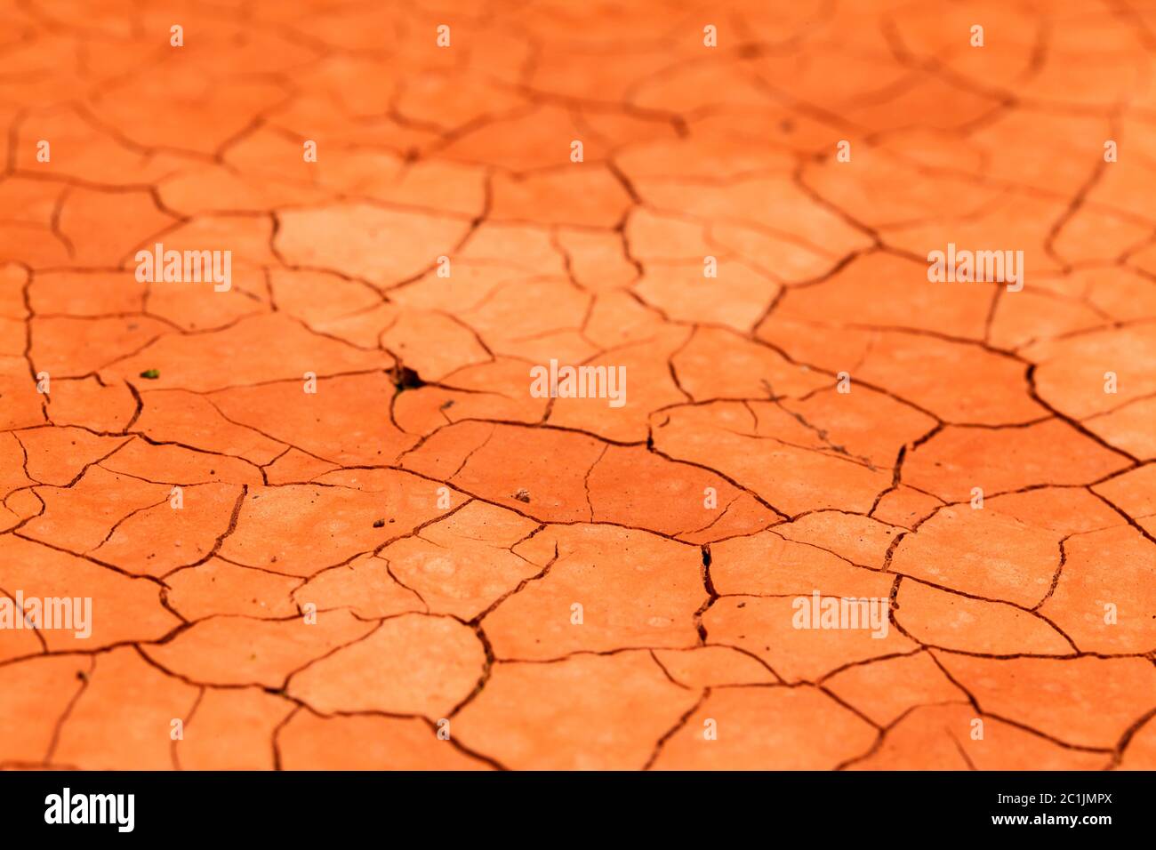 Orange drought soil pattern - no water Stock Photo - Alamy