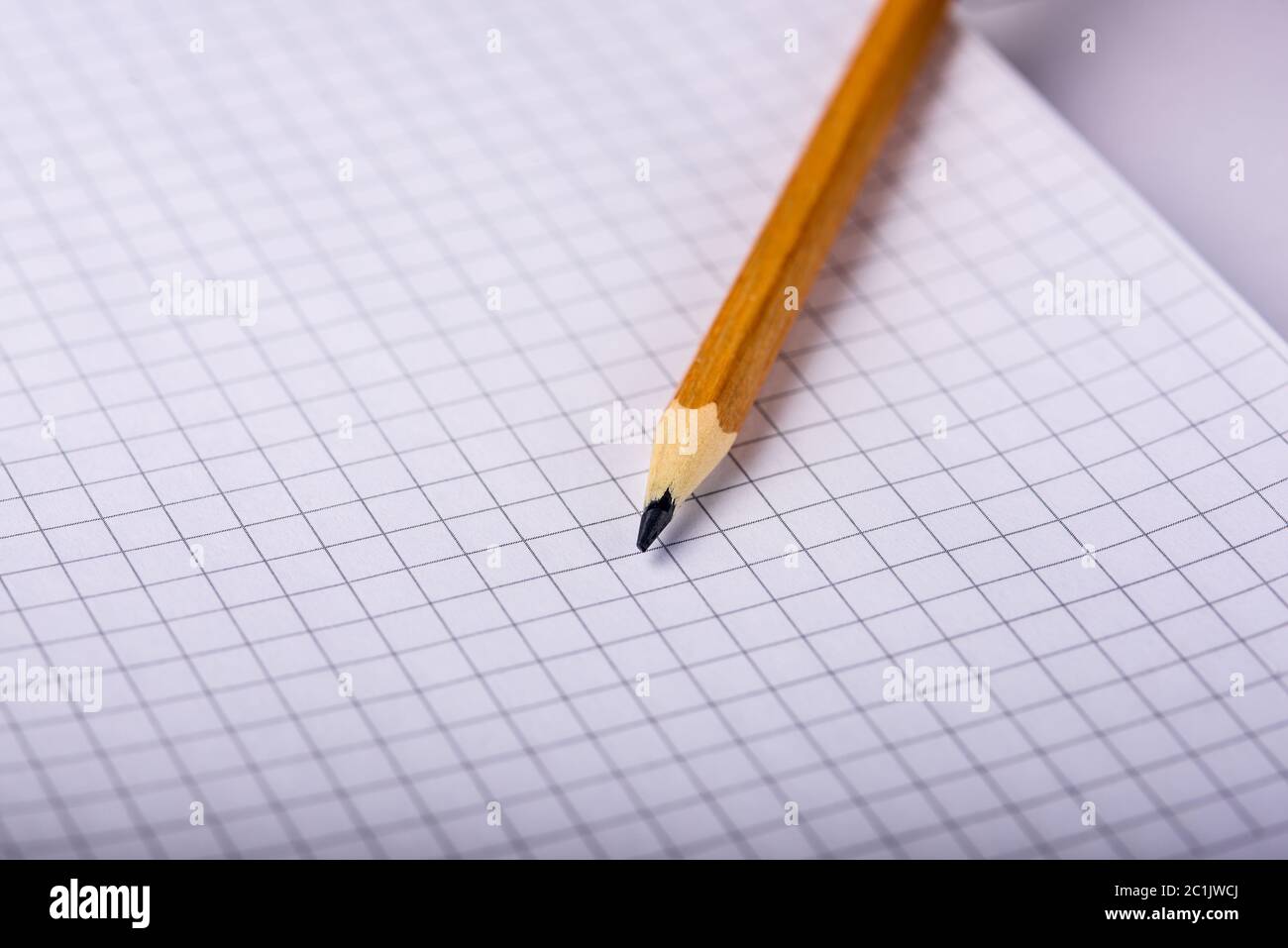 the pencil is on the notebook Stock Photo - Alamy