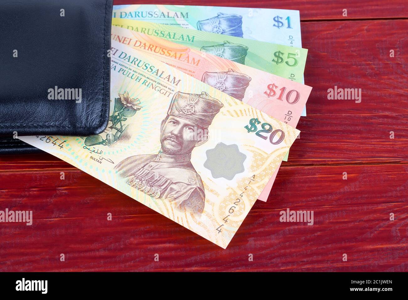 Money from Brunei in the black wallet Stock Photo - Alamy