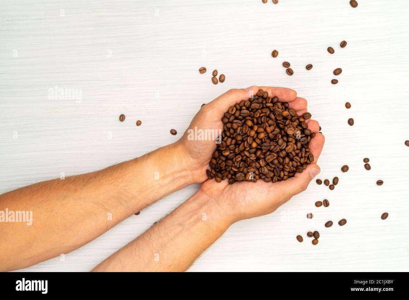 Hands with coffee beans hi-res stock photography and images - Alamy