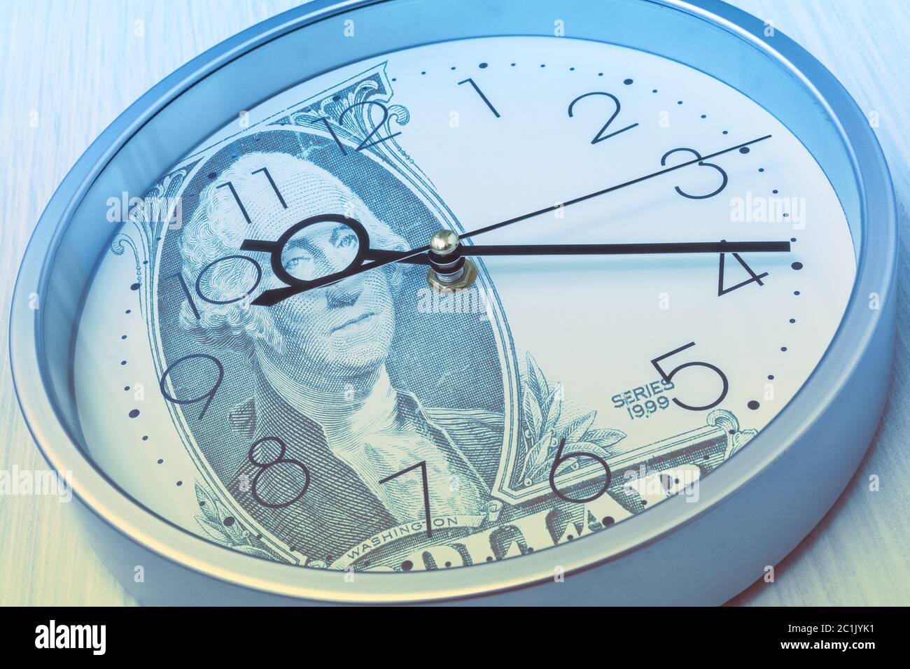 Clock face with one dollar Stock Photo - Alamy