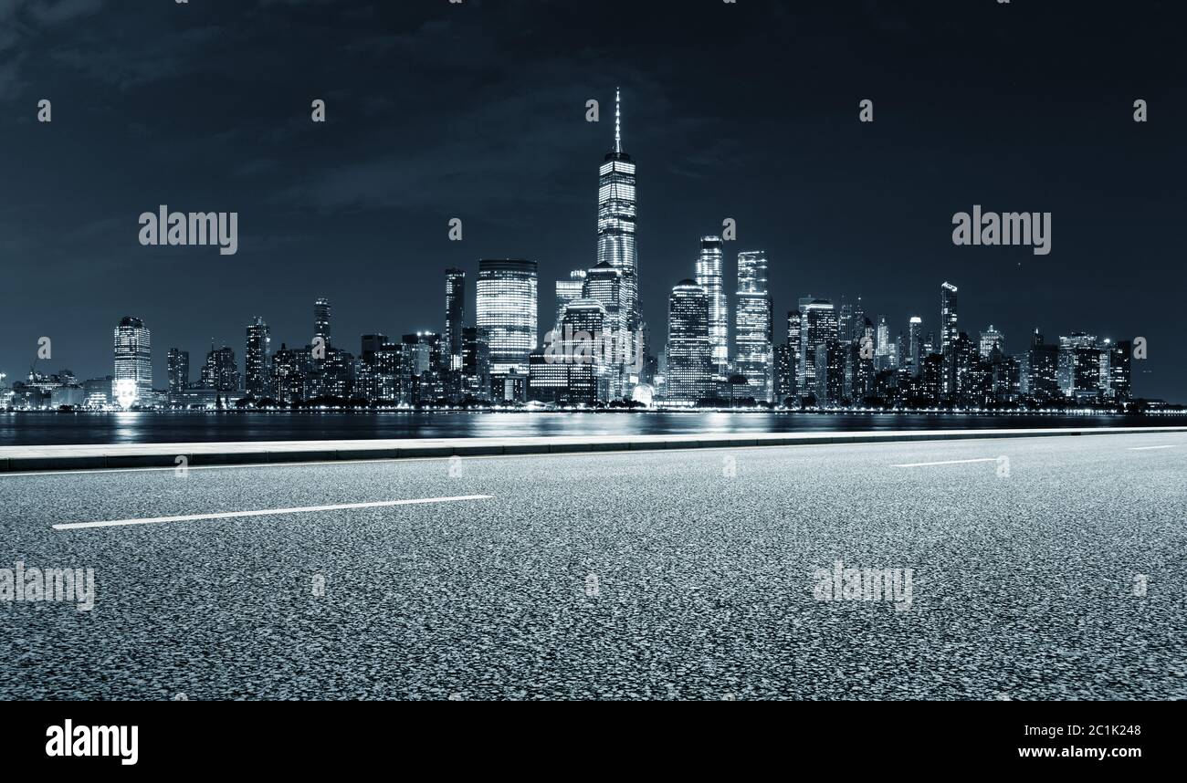 empty asphalt highway street with city skyline Stock Photo - Alamy