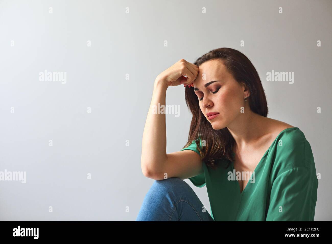 Portrait of a sad woman looking thoughtful about troubles Stock Photo ...