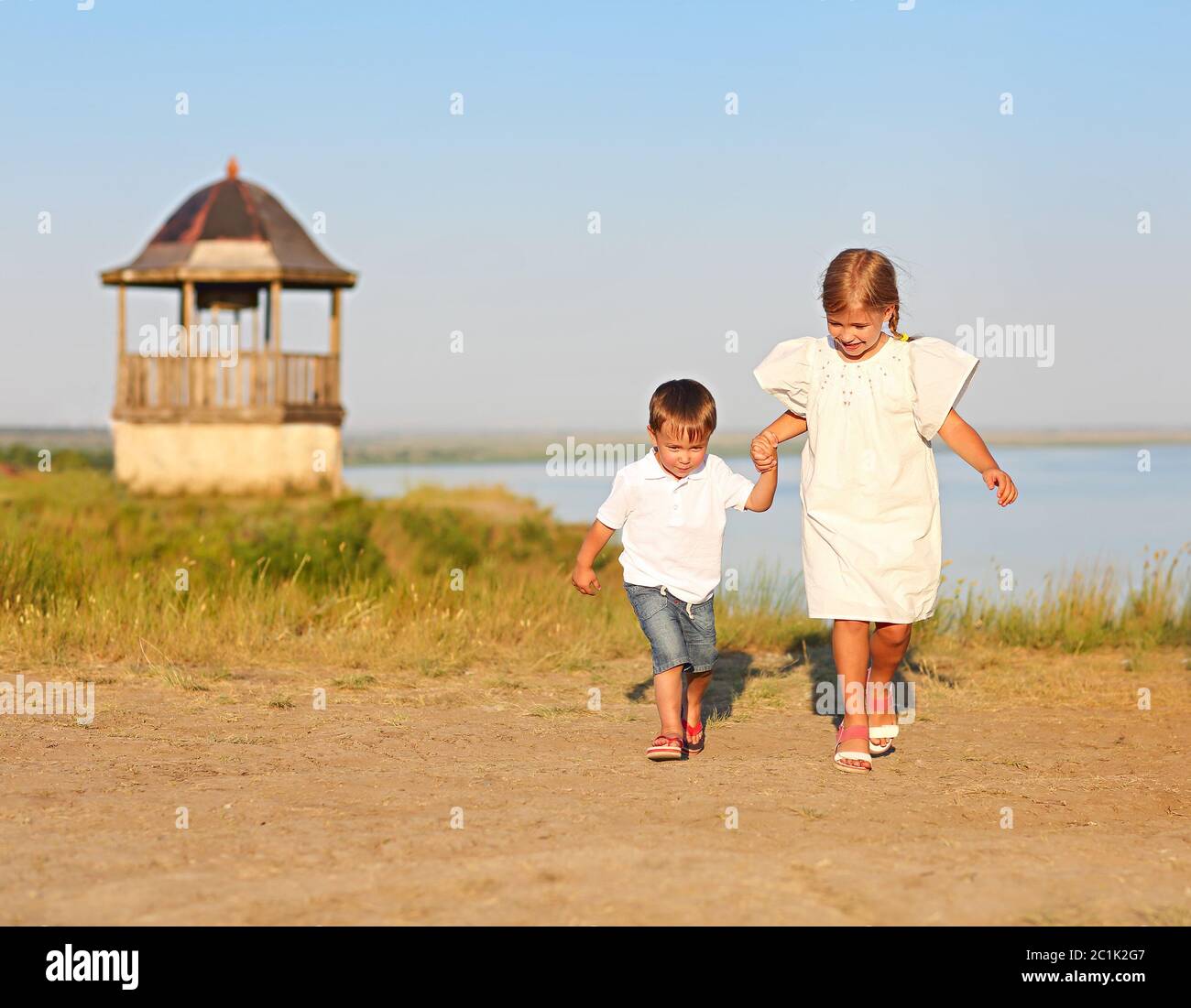 Kids playing and running in the summertime Stock Photo - Alamy