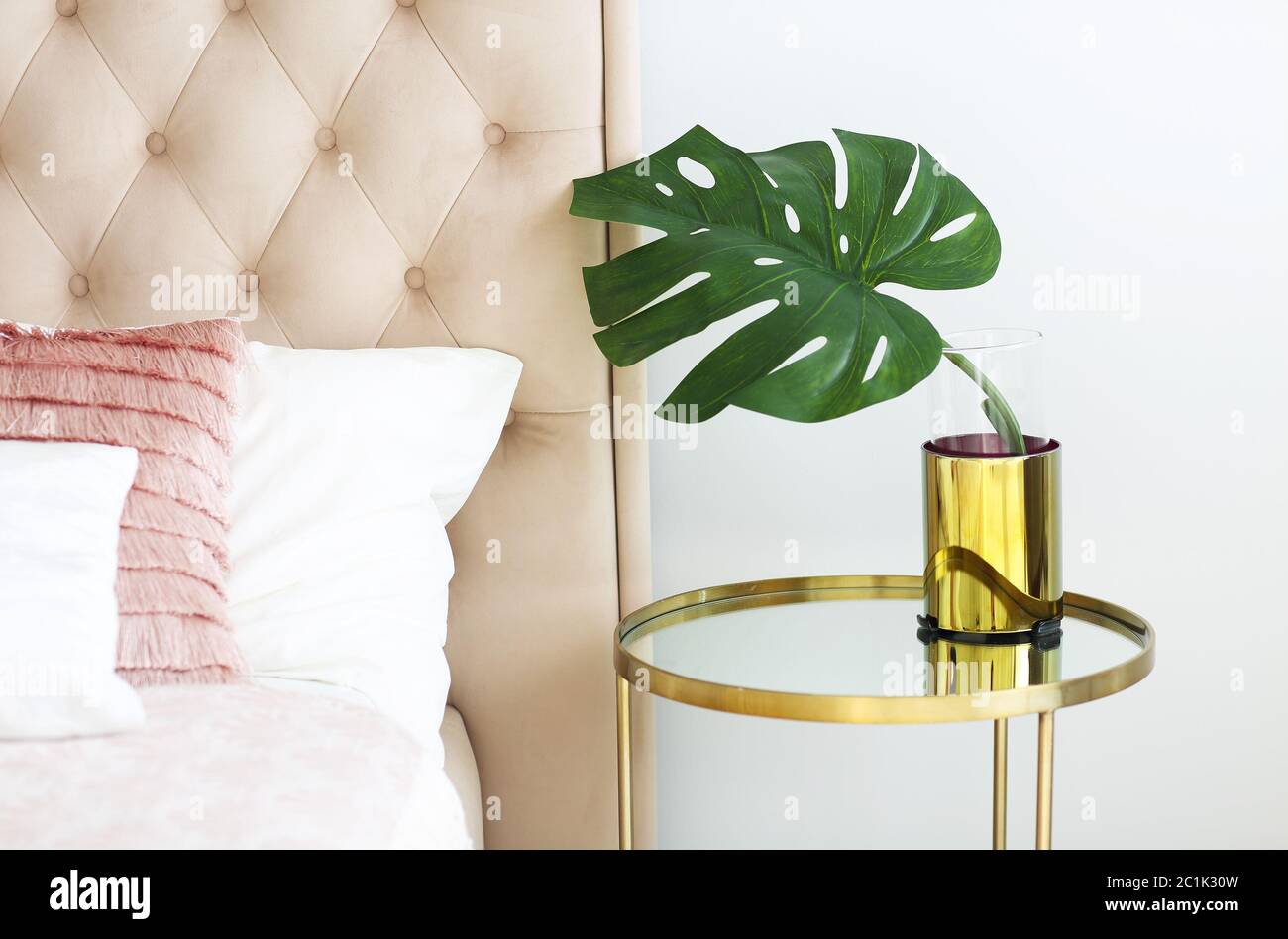 Modern bedroom with table side and pillows and coffee Stock Photo - Alamy