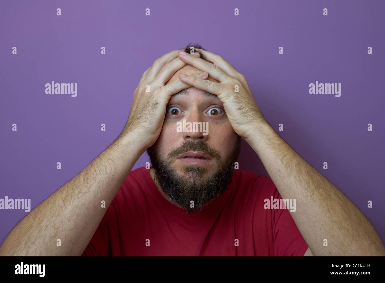 man white clutching his head Stock Photo - Alamy