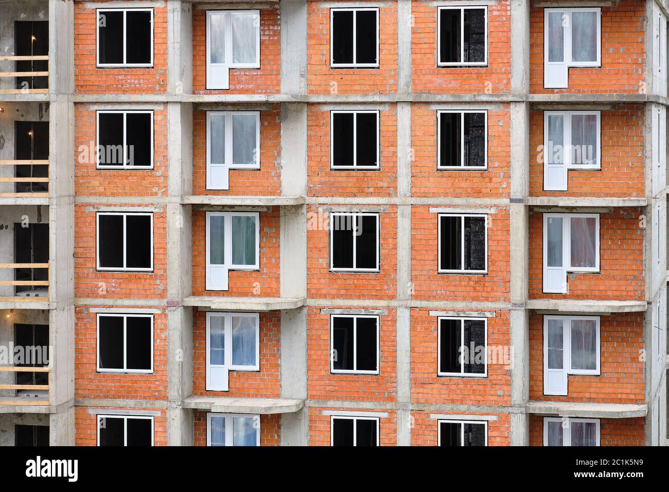 Construction of a new brick residential building with an inset of ...
