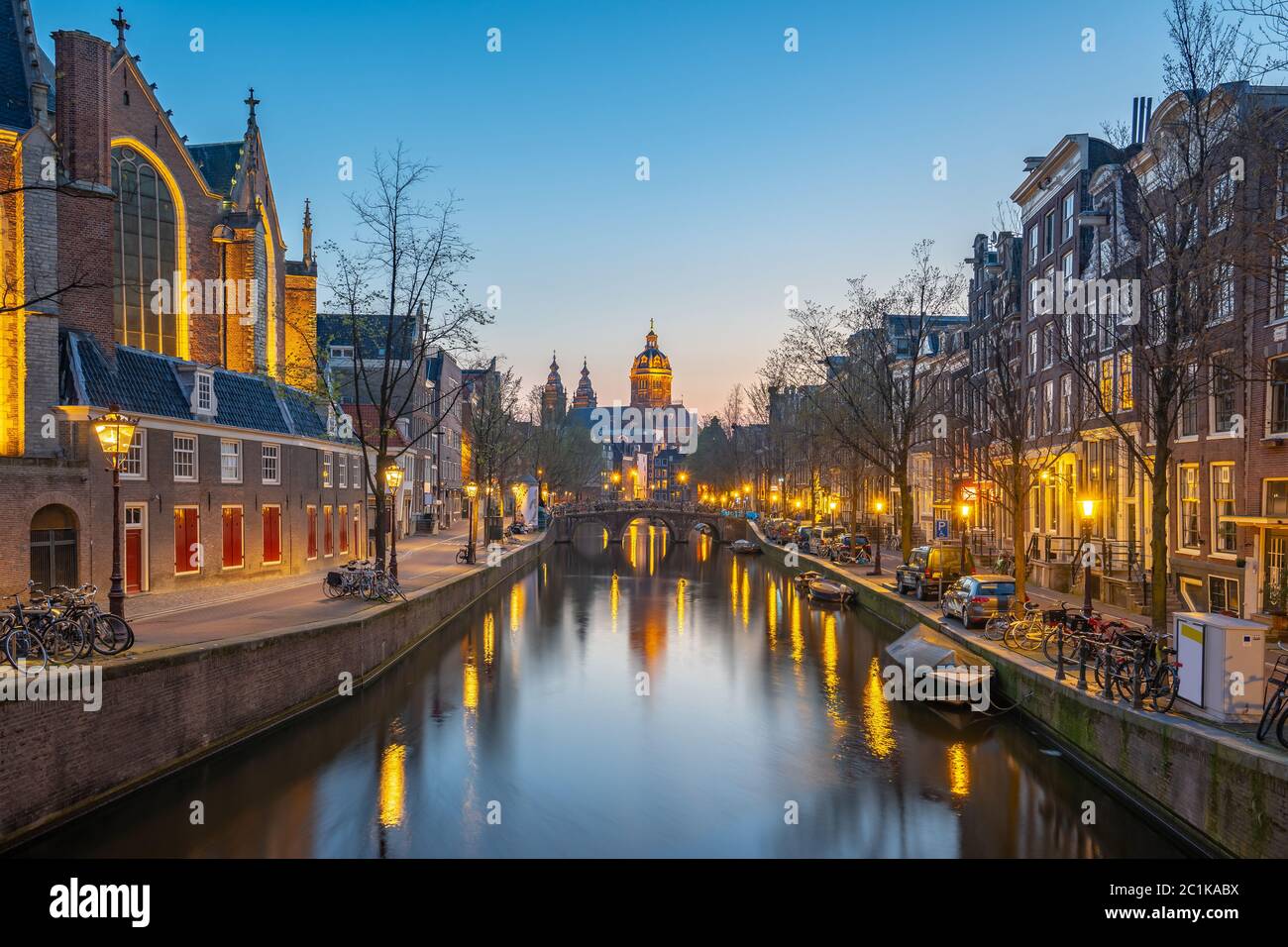 Amsterdam city at night with view of Church of Saint Nicholas in ...