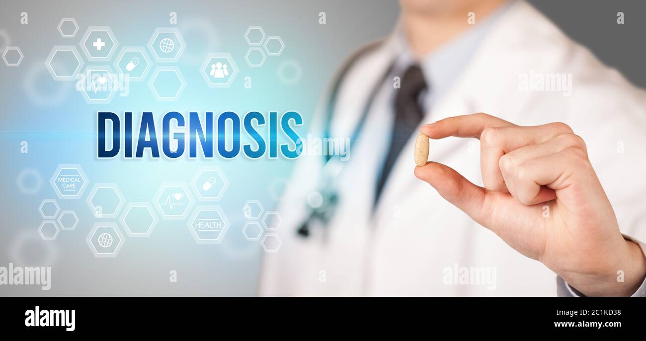 Close-up of a doctor giving you a pill with DIAGNOSIS inscription ...