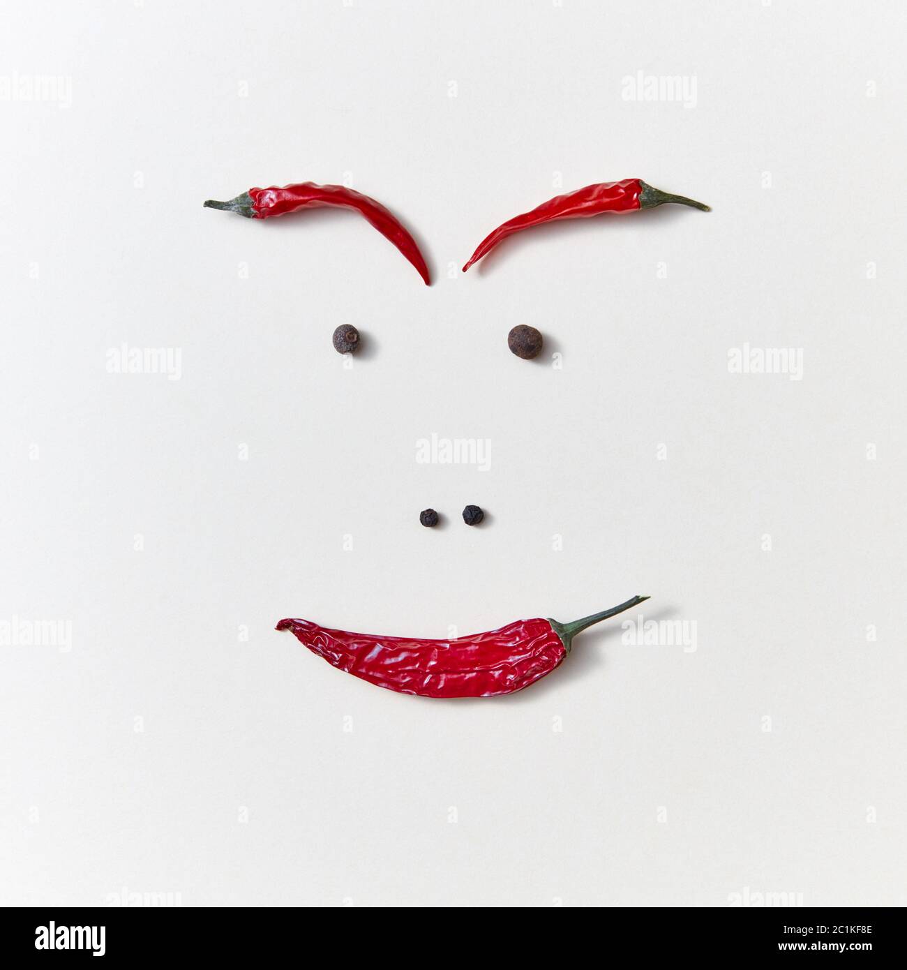 Creative pattern from red ripe chili pepper and pepper seeds in the ...