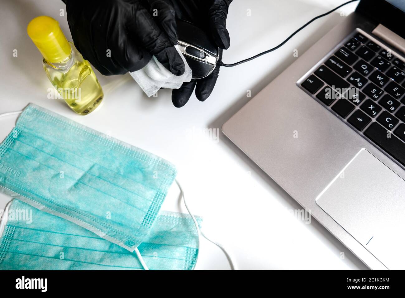 Cleaning a computer mouse to prevent bacteria and virus spreading ...