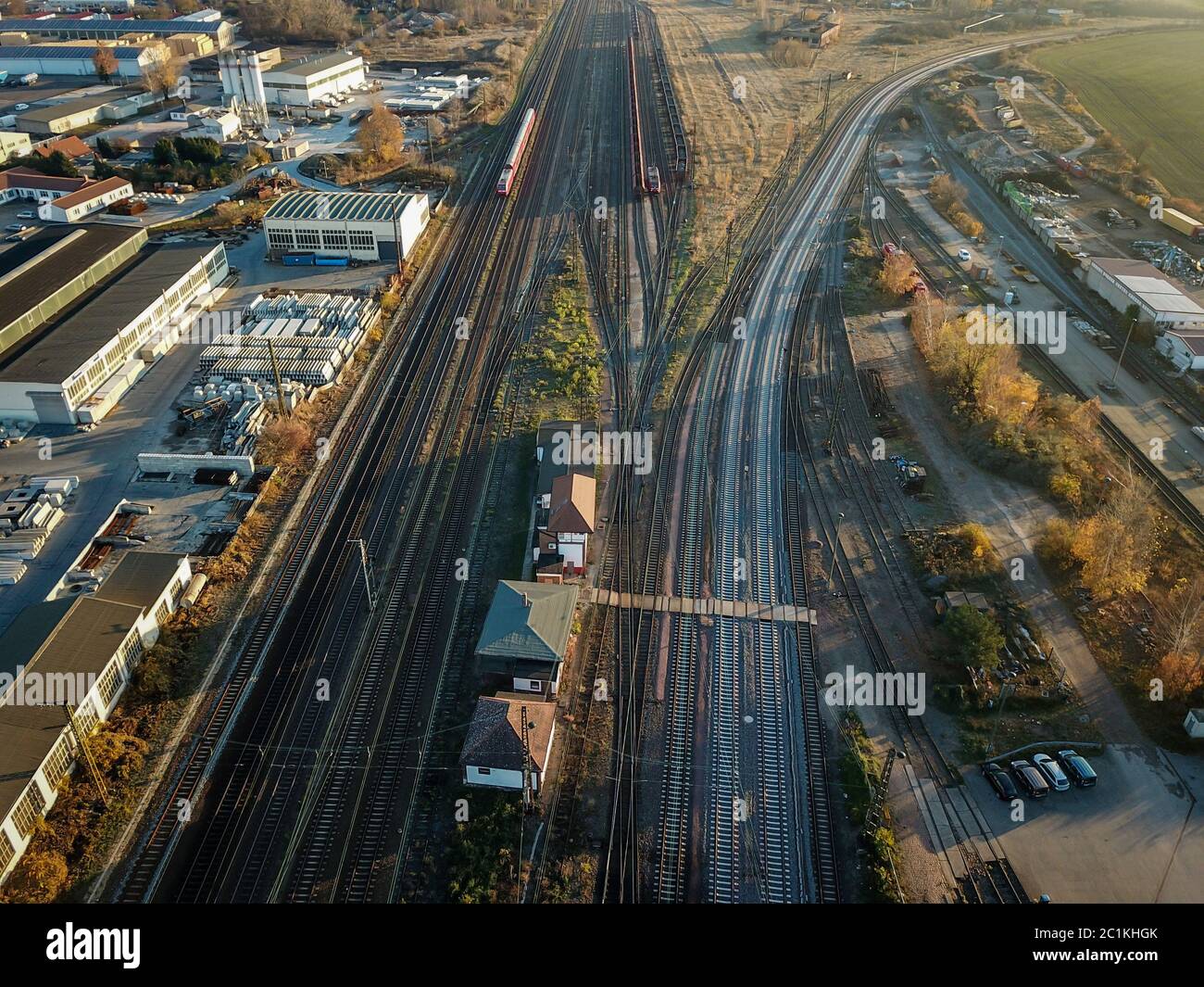Infrastructure of track system with trains, switches, road bridges and ...