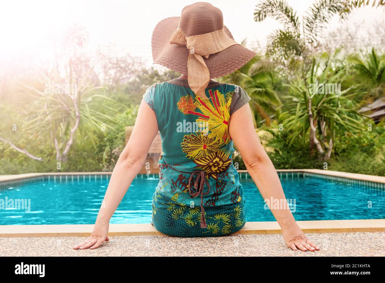 Woman in pool back view hi-res stock photography and images - Alamy