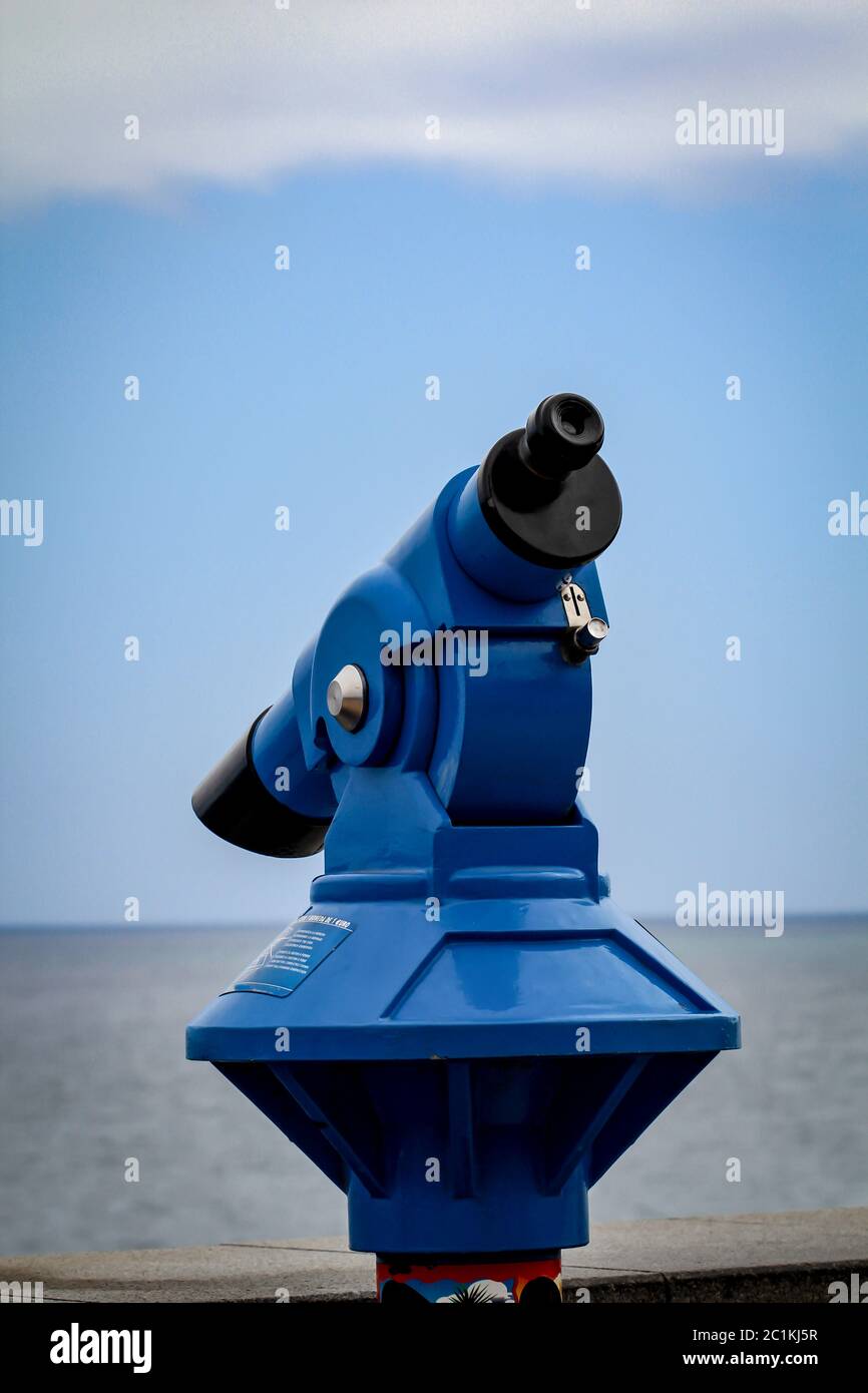 Telescope with a view of the beach Stock Photo - Alamy