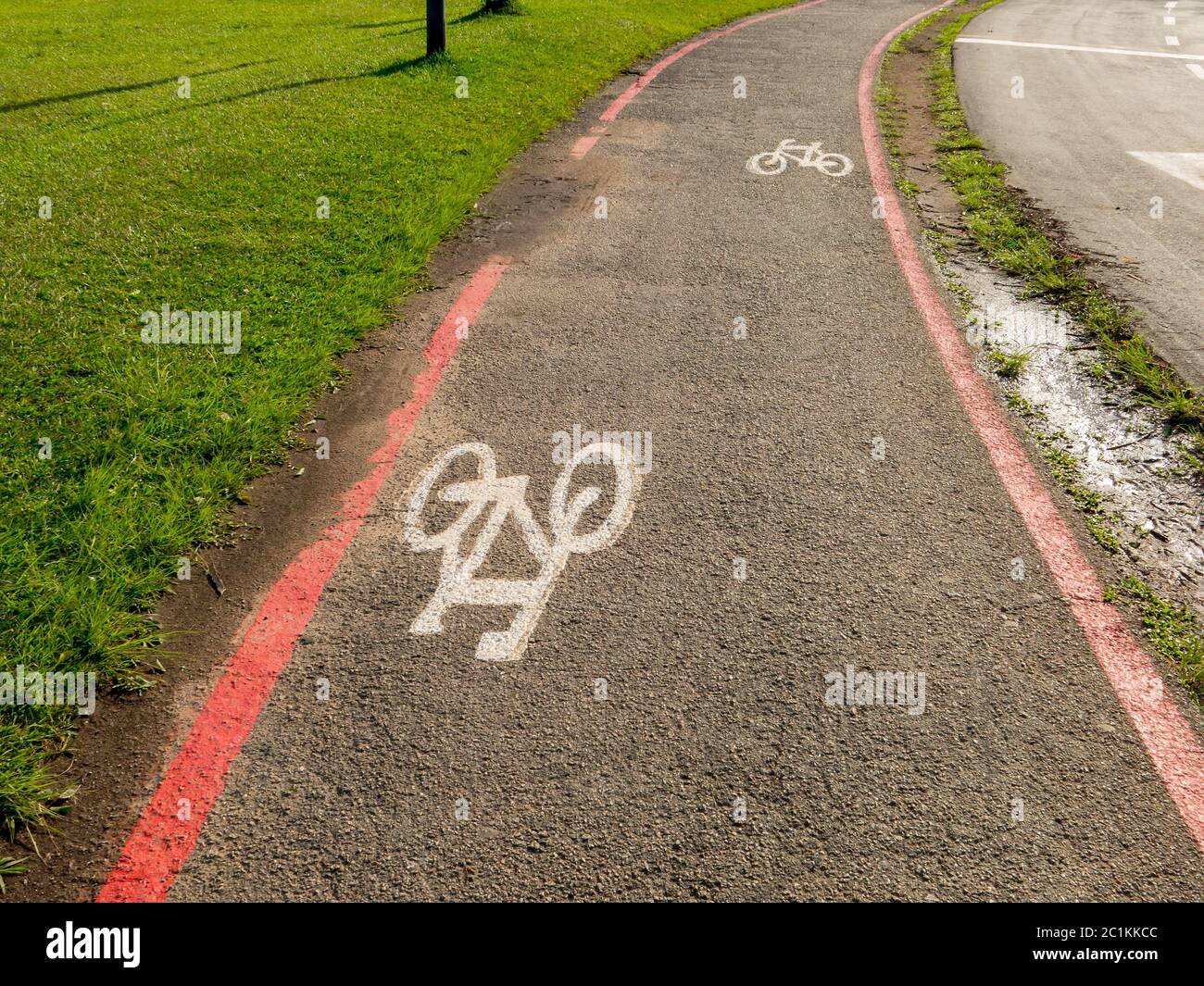 Bike Lane signs on streets ground Stock Photo - Alamy